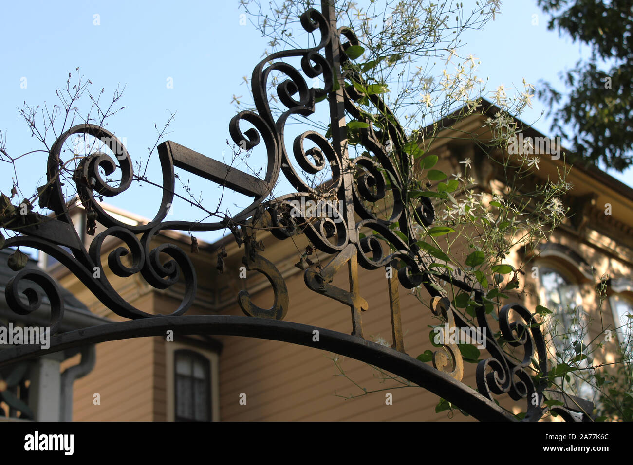 A gothic gate with an address for a house Stock Photo - Alamy