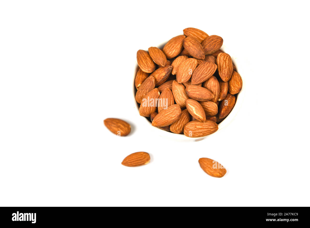 Almonds bowl isolated on white background / Close up almond nuts ...