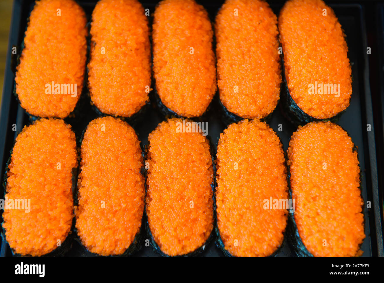Japanese food sushi roll rice with Tobiko egg is orange (flying fish ...