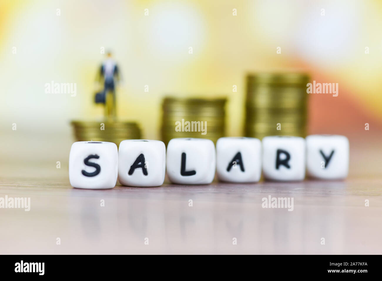 Payroll and salaries ladder increase growth money coins on table and ...