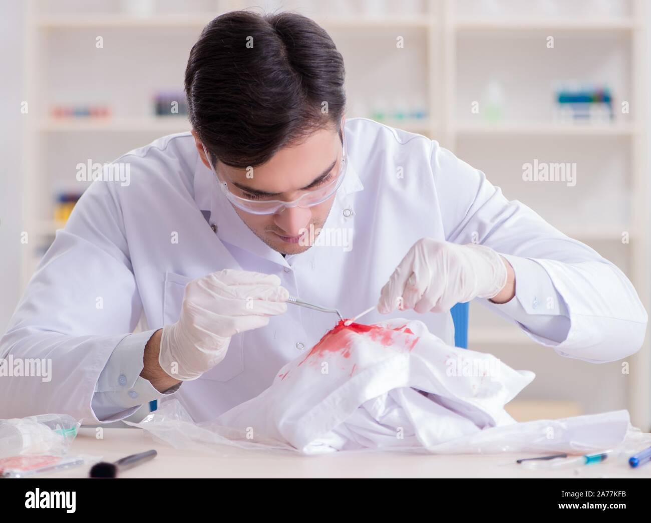 The expert criminologist working in the lab for evidence Stock Photo ...