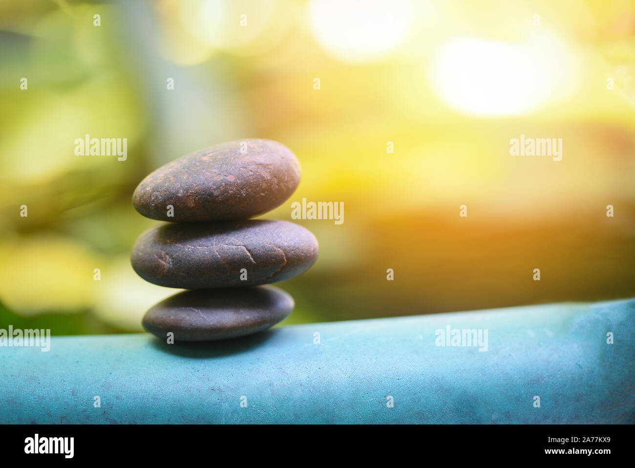 Natural wellness concept / Relax zen stones stack on wooden nature ...