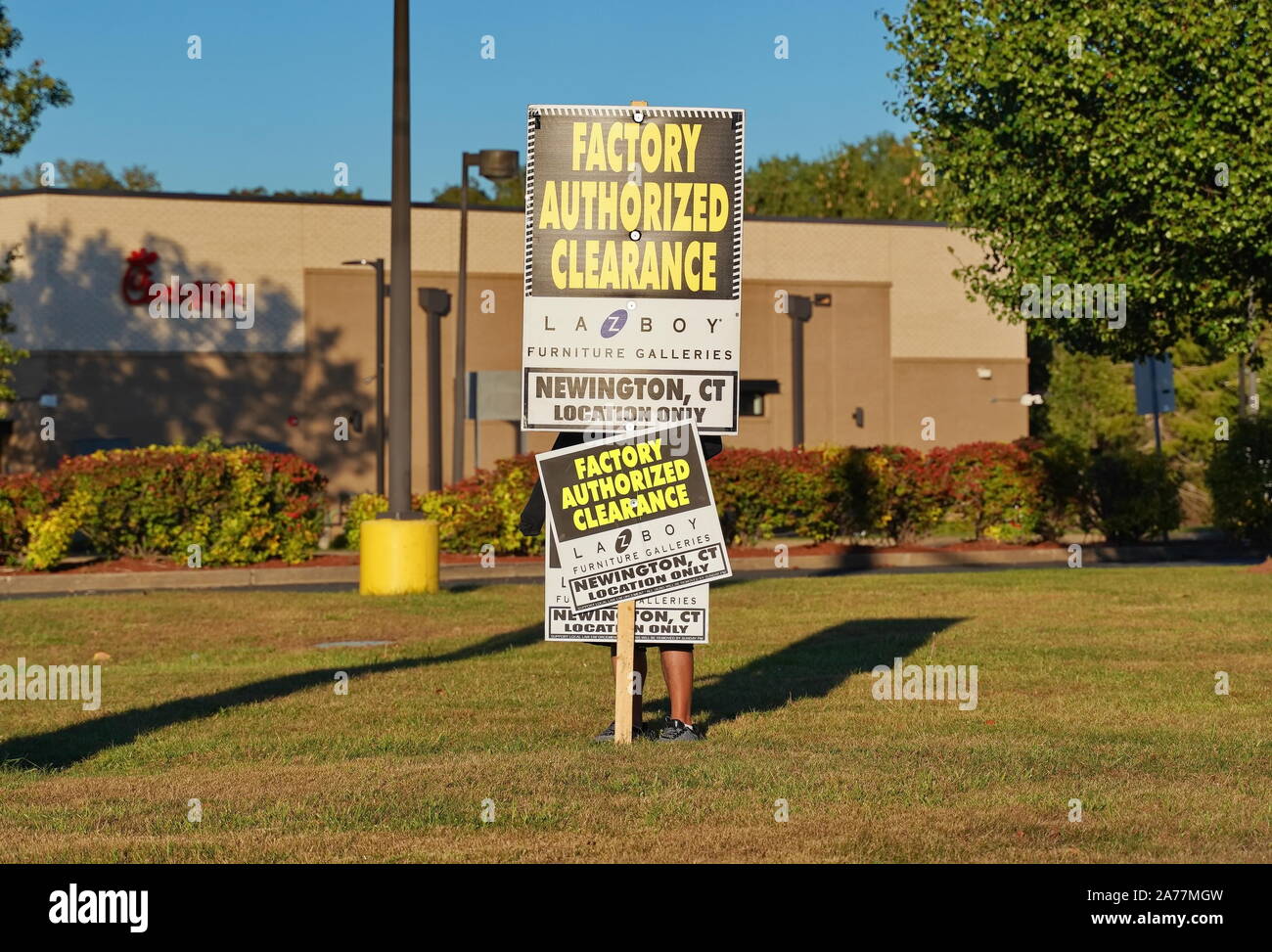 Berlin, CT USA. Oct 5 2019. Walking billboard man hiding behind his own ...