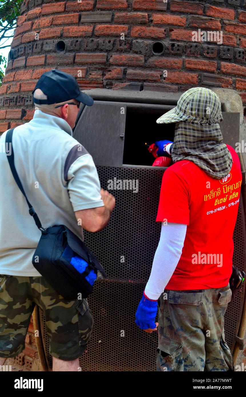 Firecracker being set off in a brick oven with smoke billowing out of ...