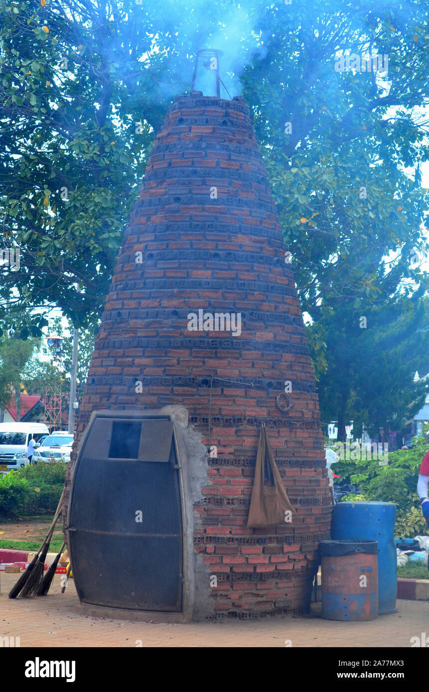 Firecracker being set off in a brick oven with smoke billowing out of ...