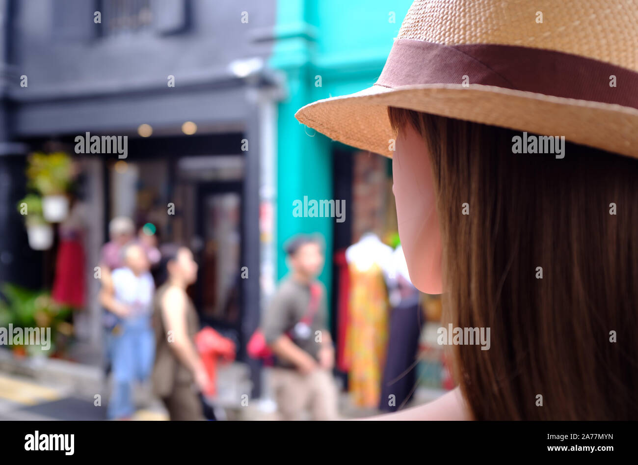 Female model figure back view on shopping street Stock Photo - Alamy