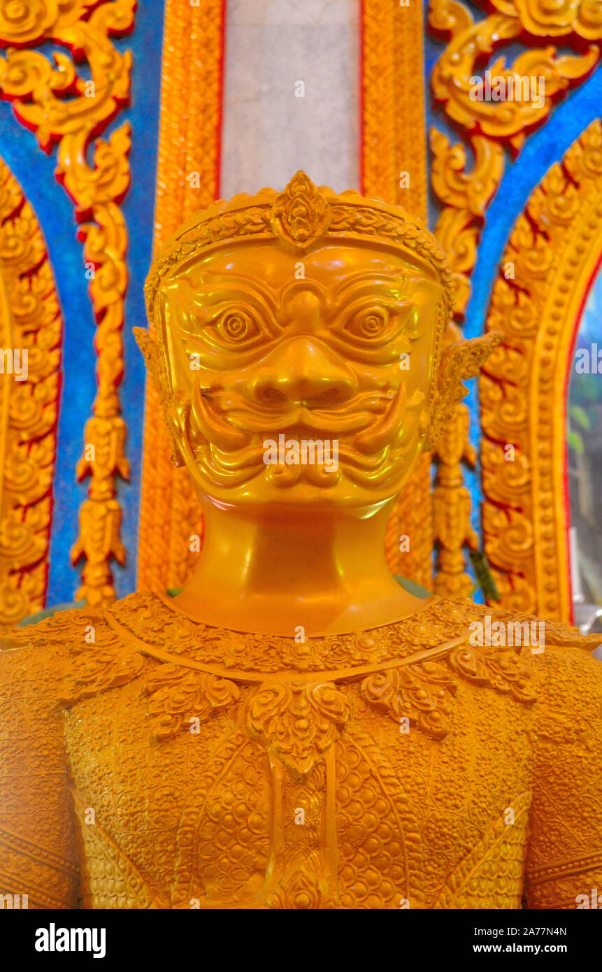 A close up photo of a Yaksha statue at Chalong Temple Phuket Thailand ...
