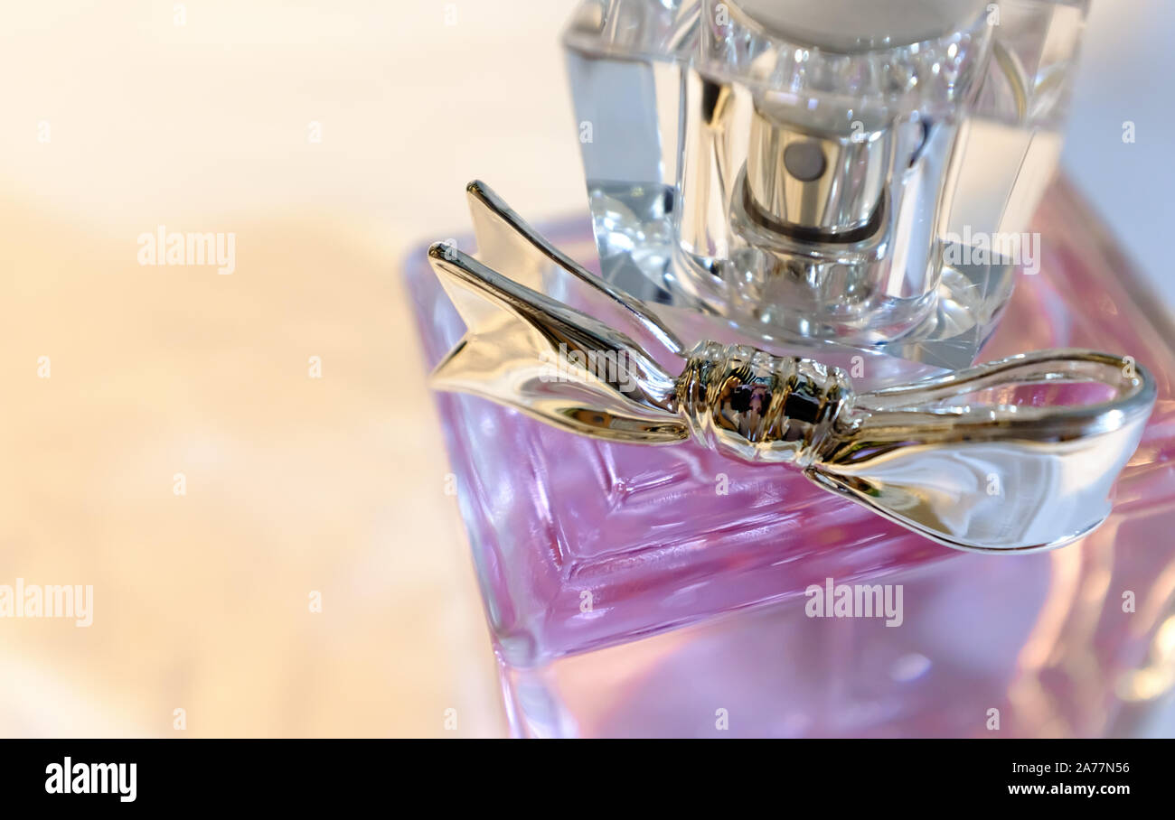 A bottle of perfume purple color.Transparent bottle of perfume Stock ...