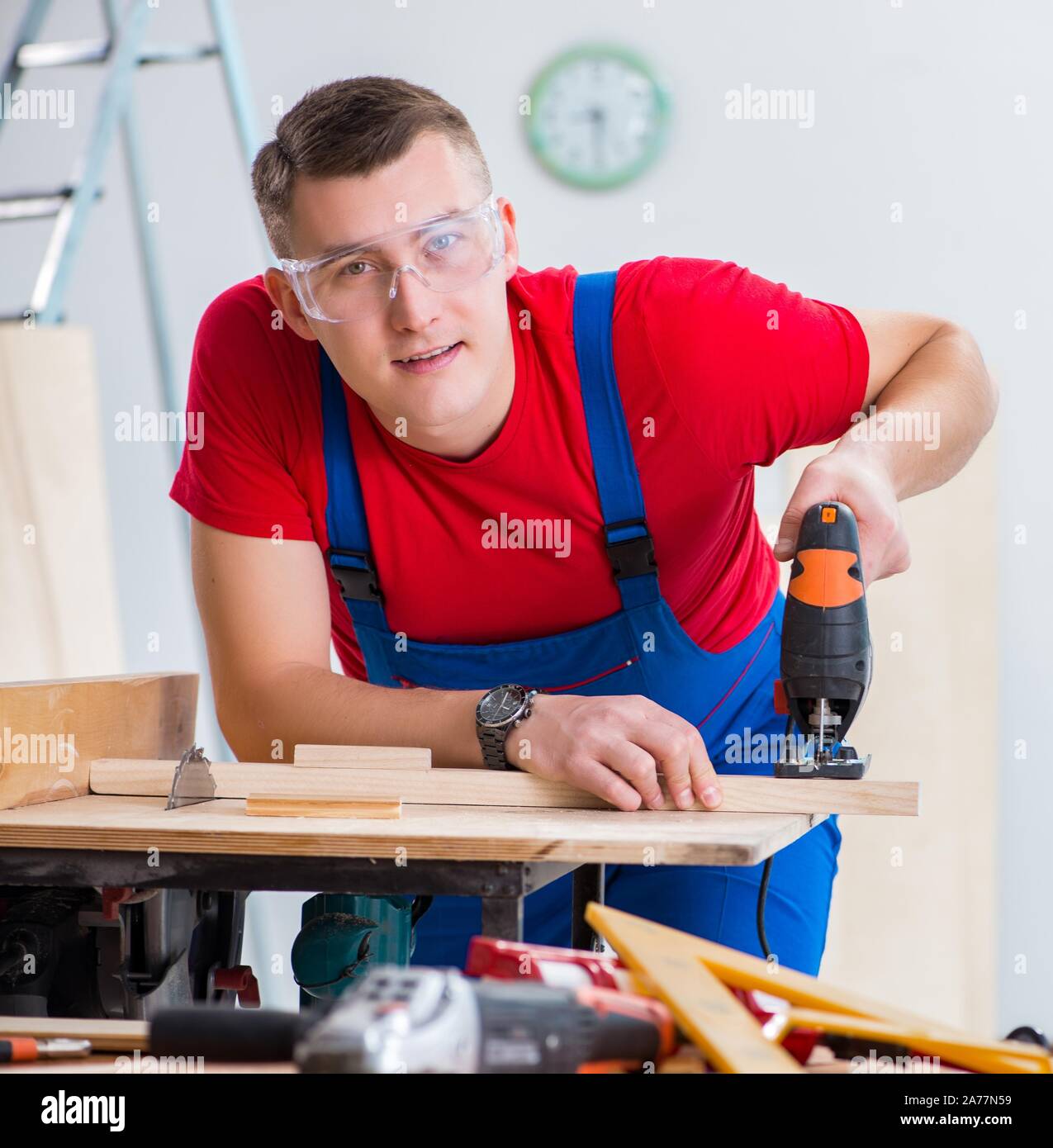 The contractor working in the workshop Stock Photo - Alamy