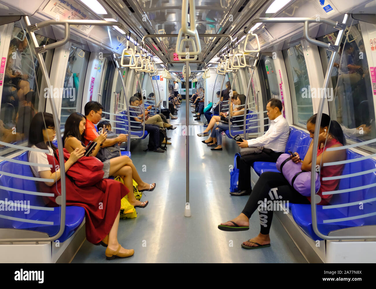 Singapore-21 MAR 2018: Passengers in a crowded Mass Rapid Transit (MRT ...