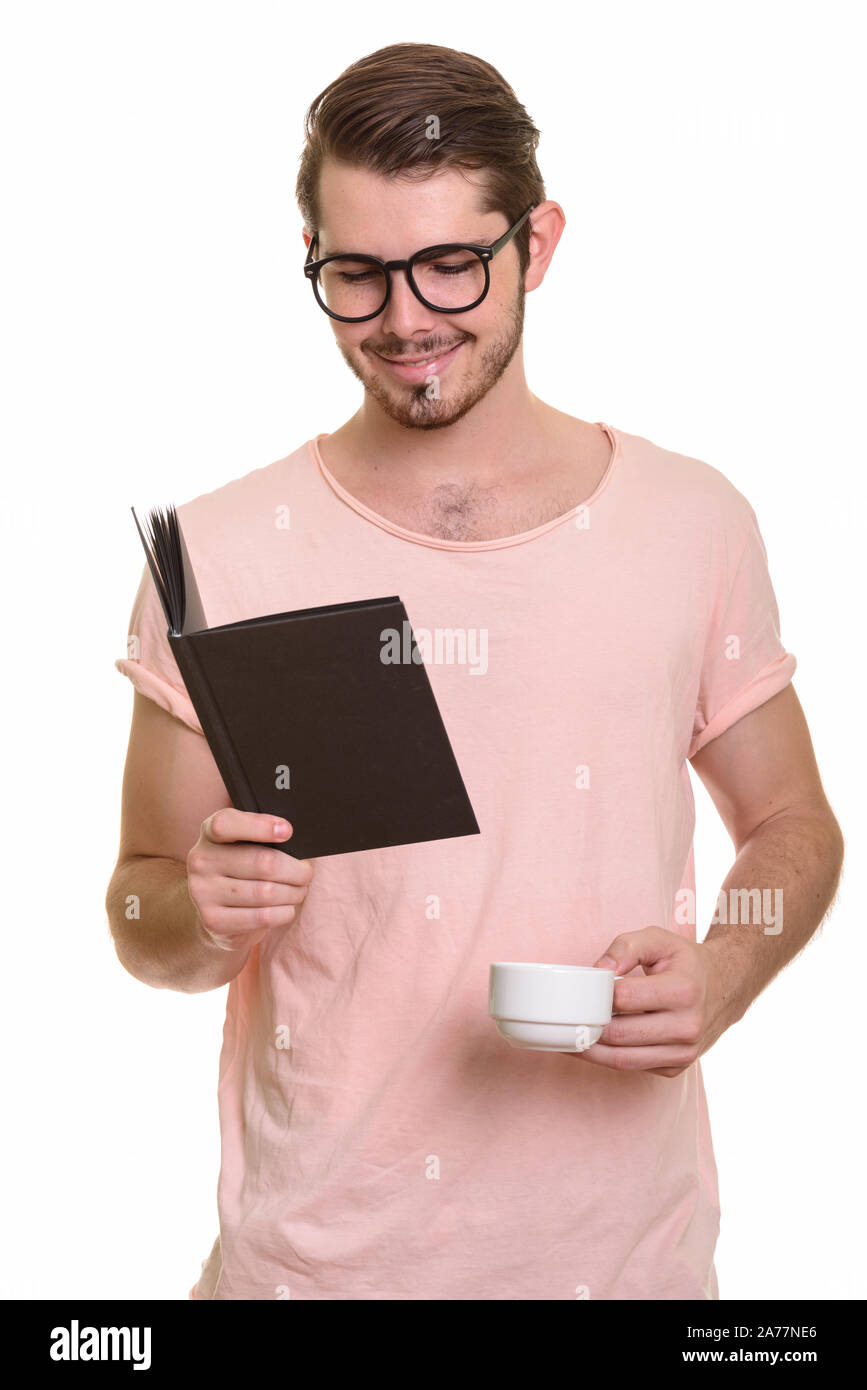 Portrait of young handsome bearded man reading book Stock Photo - Alamy