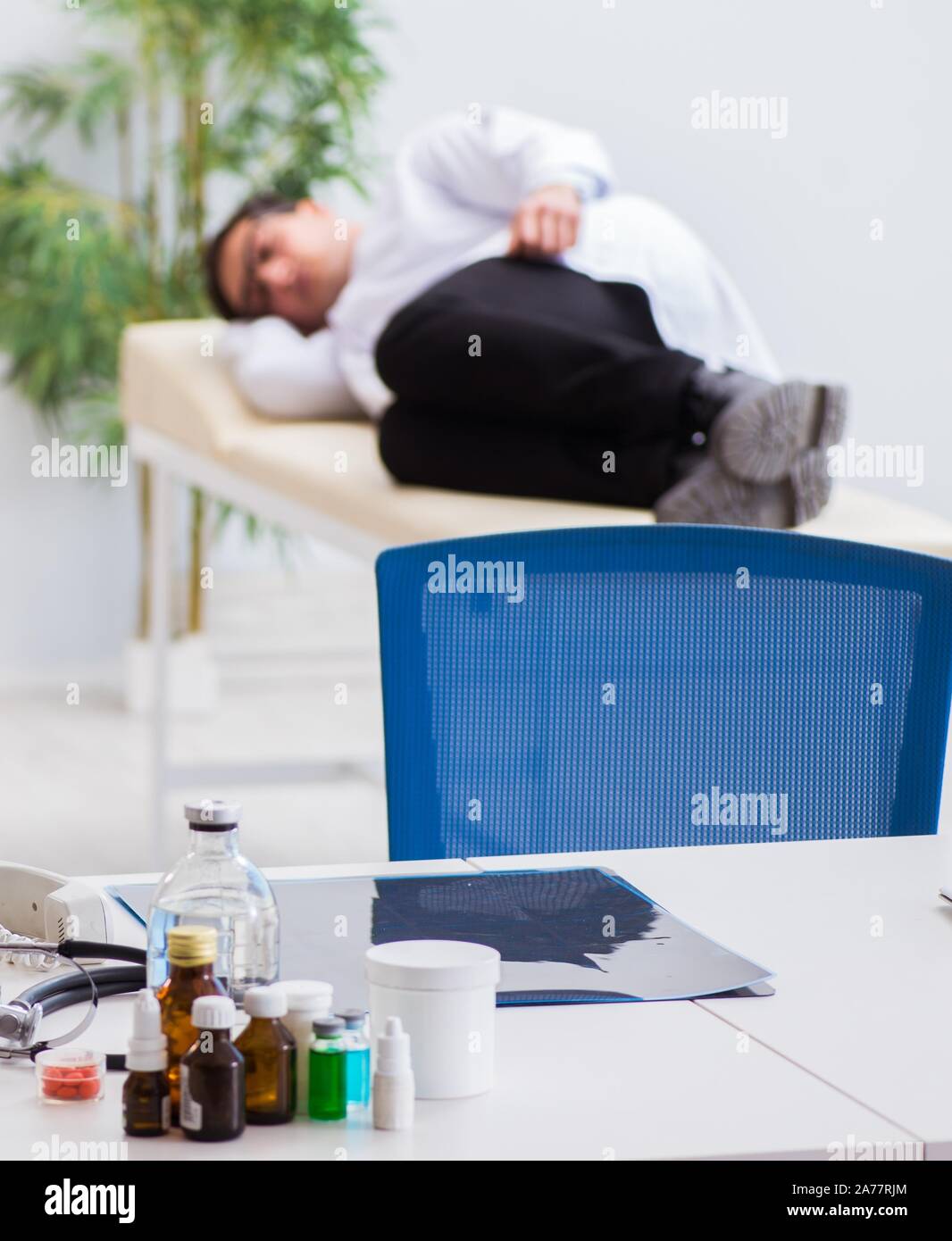 Doctor relaxing after complex surgery in hospital Stock Photo - Alamy