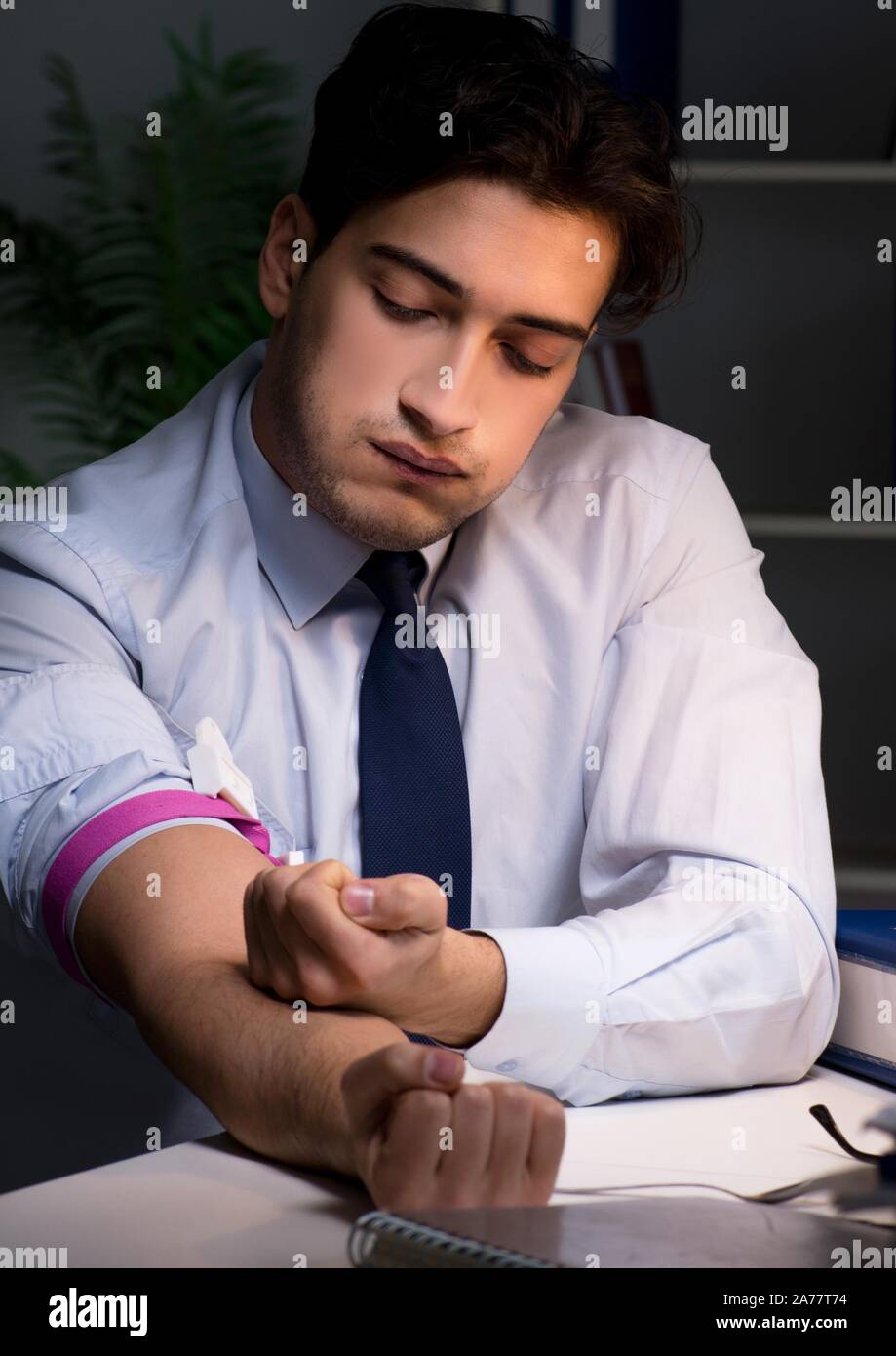 The employee relieving stress from overtime with drugs narcotics Stock ...