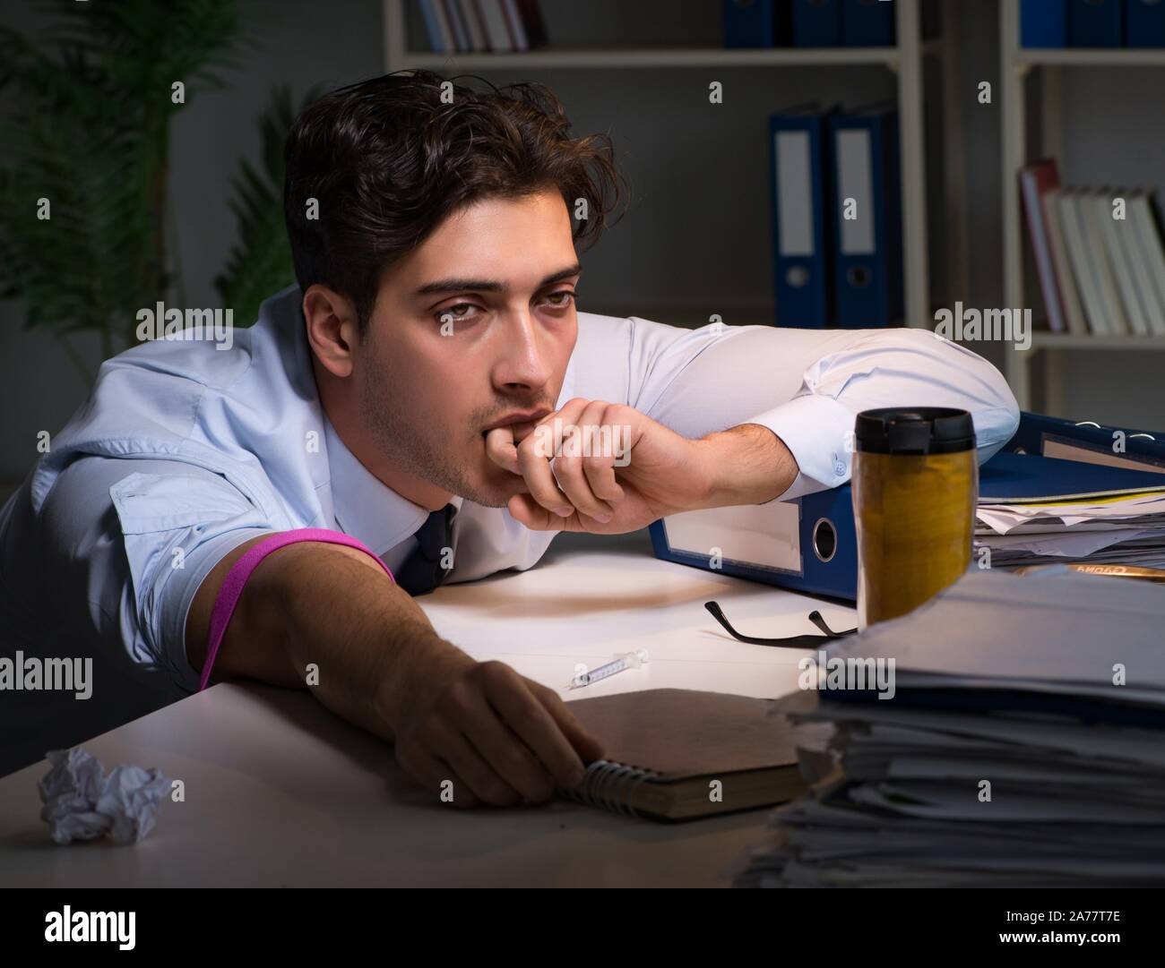 The employee relieving stress from overtime with drugs narcotics Stock ...