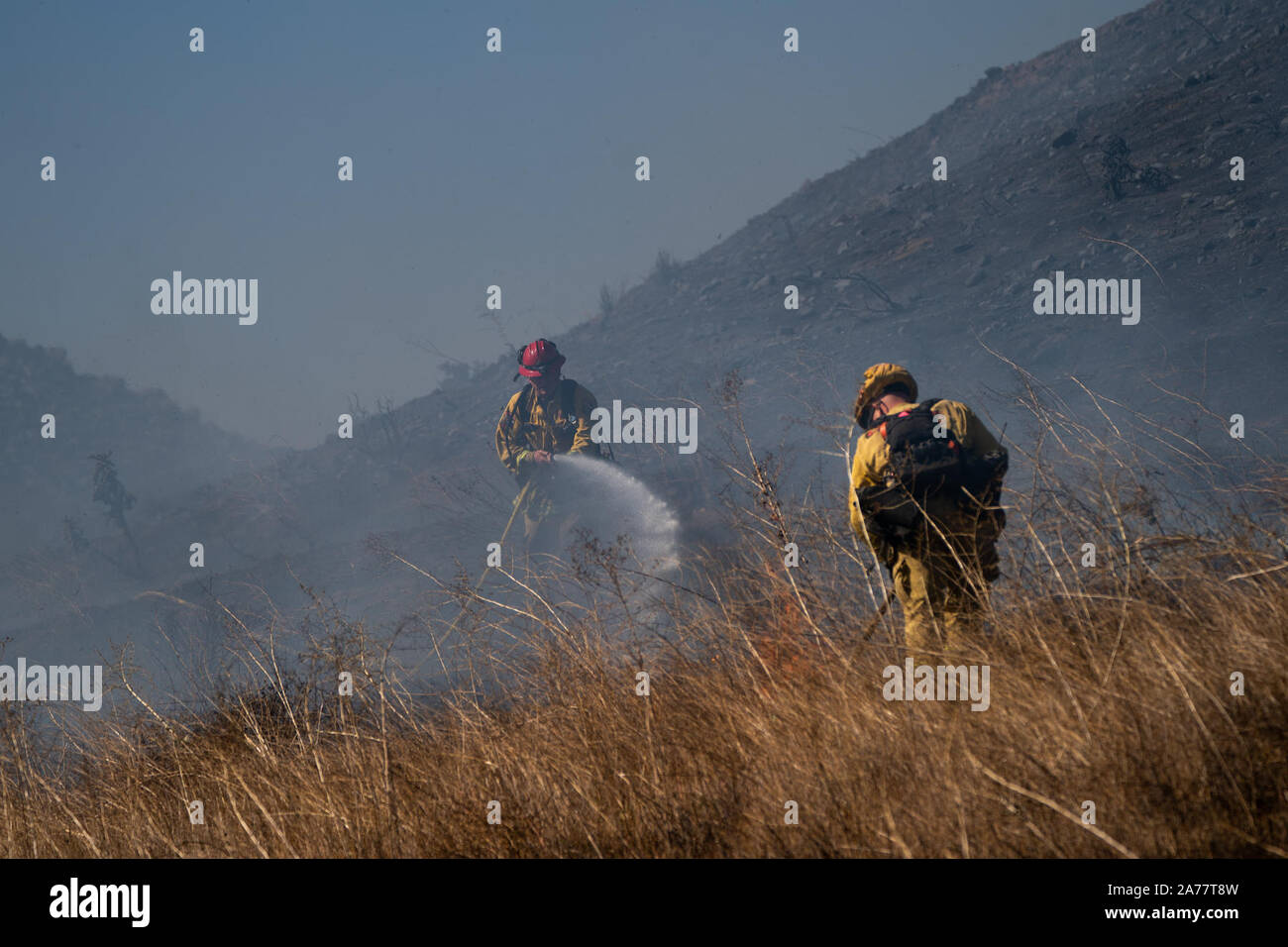 Simi Valley, California, USA. 30th Oct, 2019. Firefighters work in Simi ...