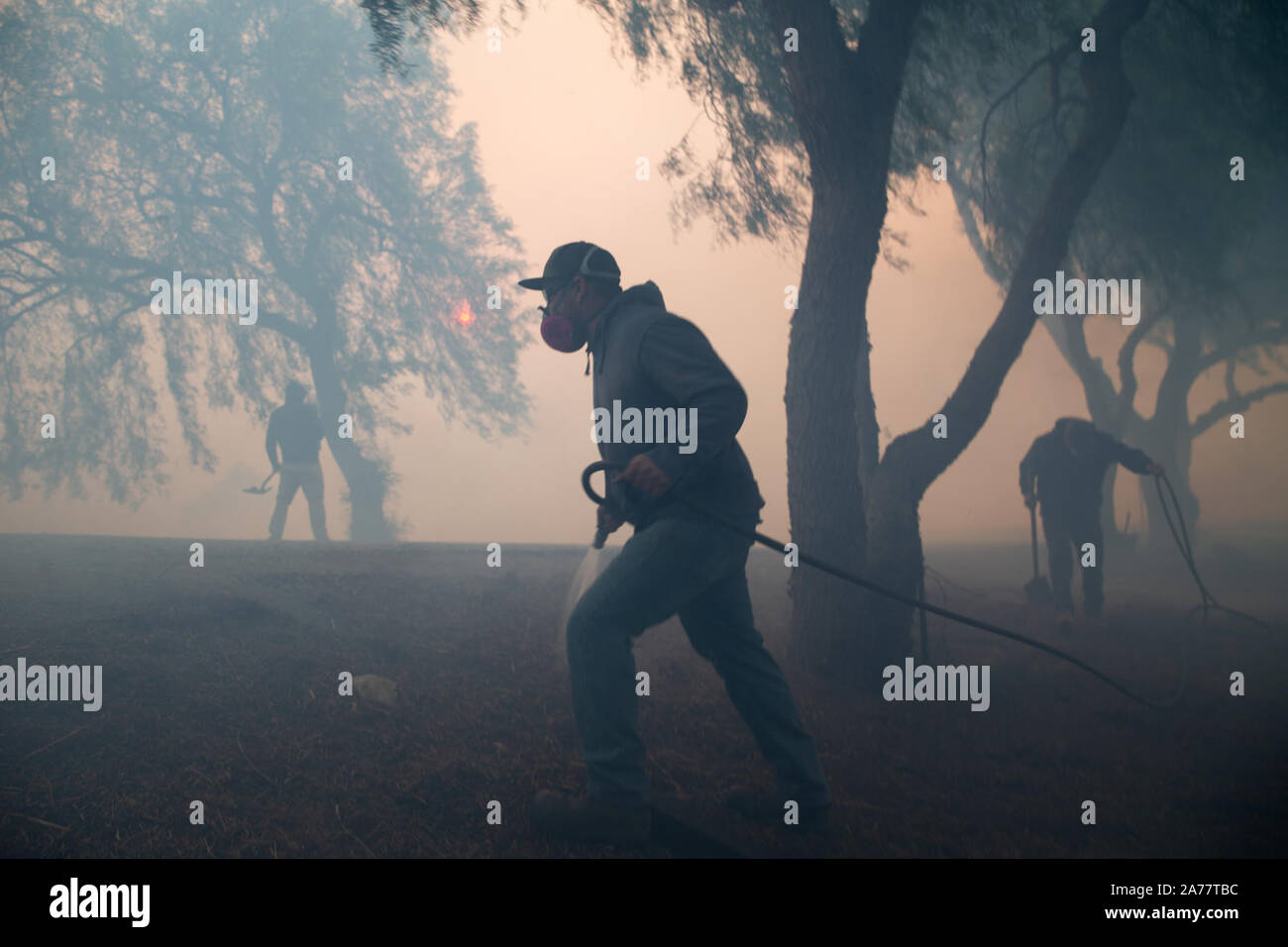 Simi Valley, California, USA. 30th Oct, 2019. Residents try to remove ...