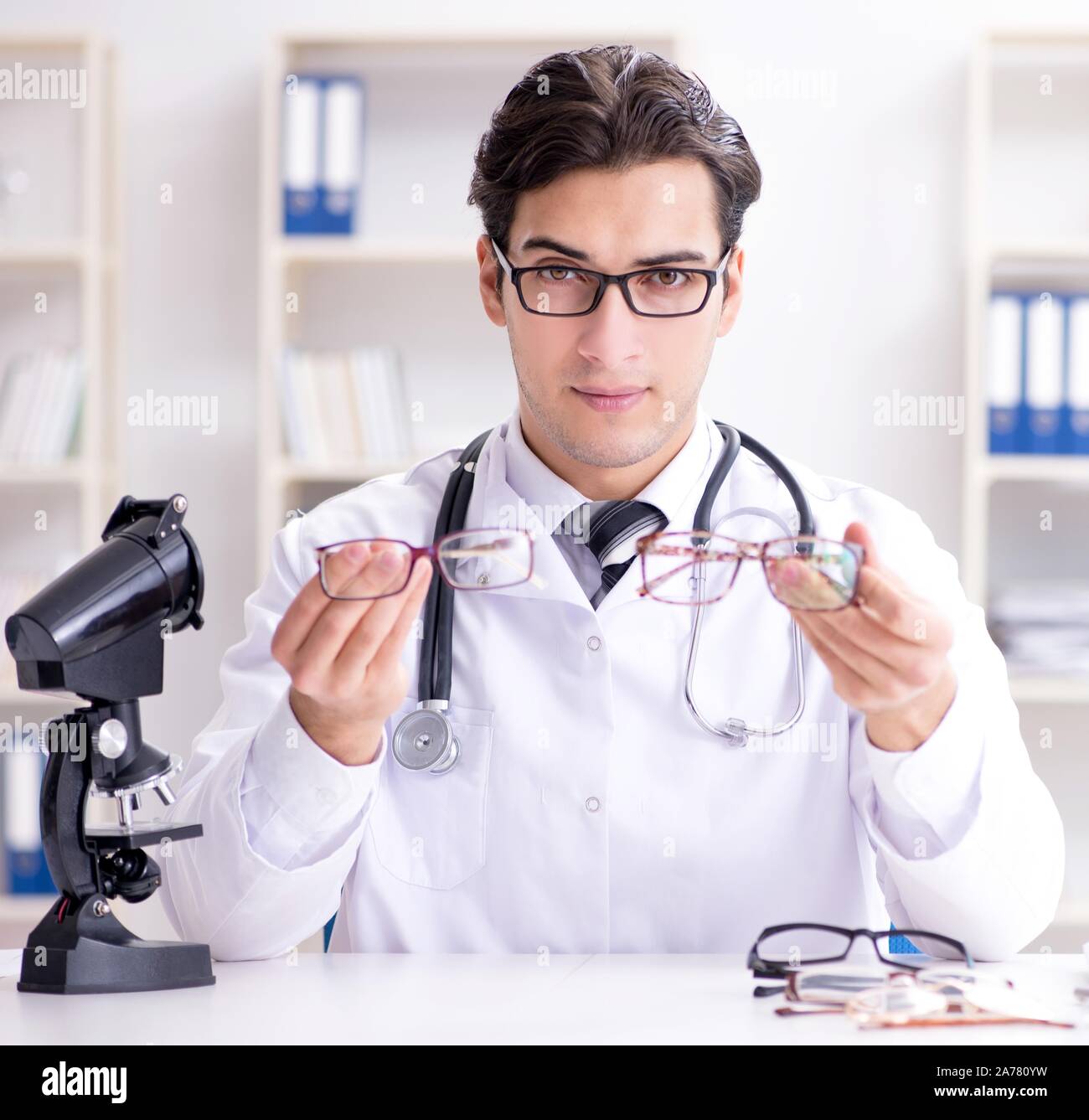 The eye doctor in medical concept Stock Photo - Alamy