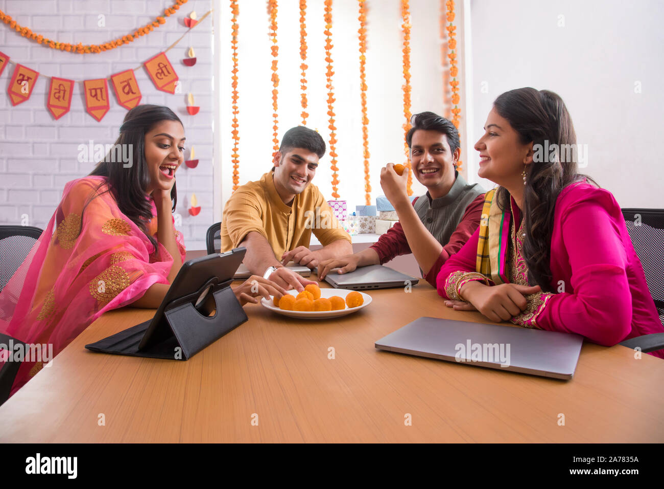 Diwali sweets eating hi-res stock photography and images - Alamy