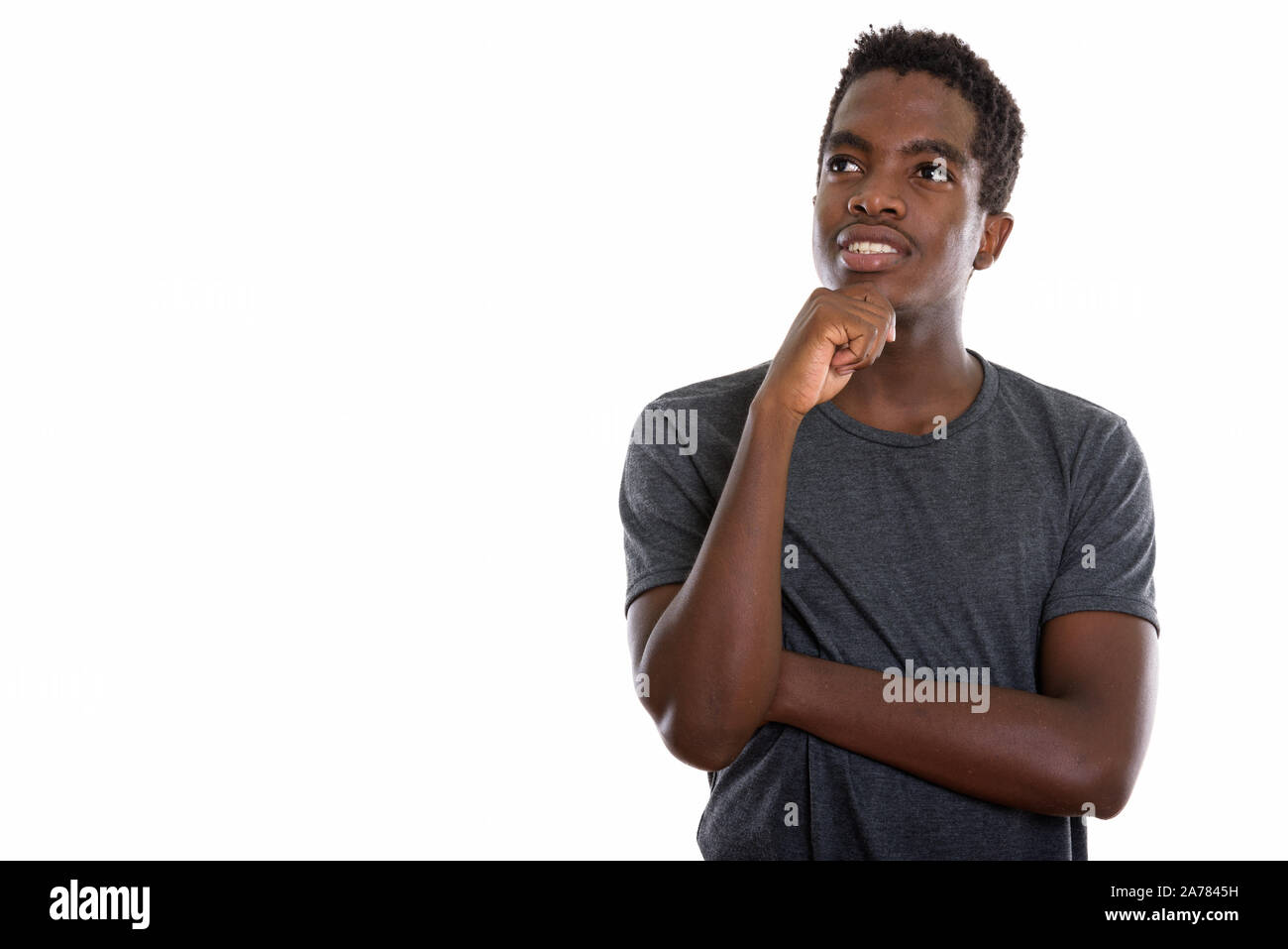 Studio shot of young African teenage boy with Afro hair Stock Photo - Alamy
