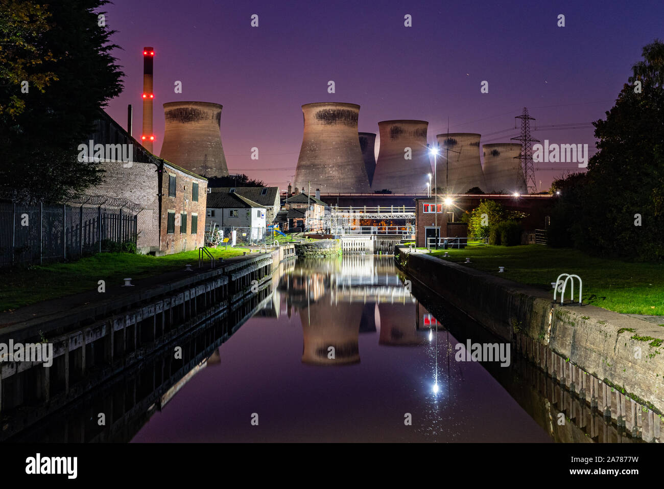 Perfect reflection of the cooling towers at Ferrybridge Power Station ...