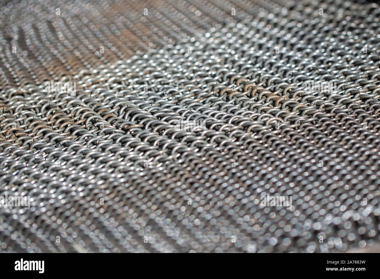 Medieval chain mail, weave iron rings linked together Stock Photo - Alamy