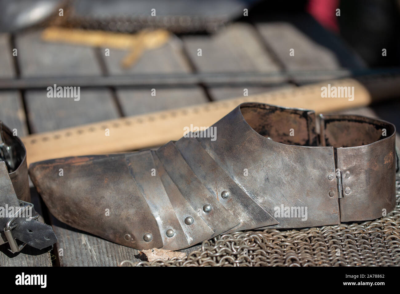 Medieval protective metal boot. Vintage thing Stock Photo - Alamy