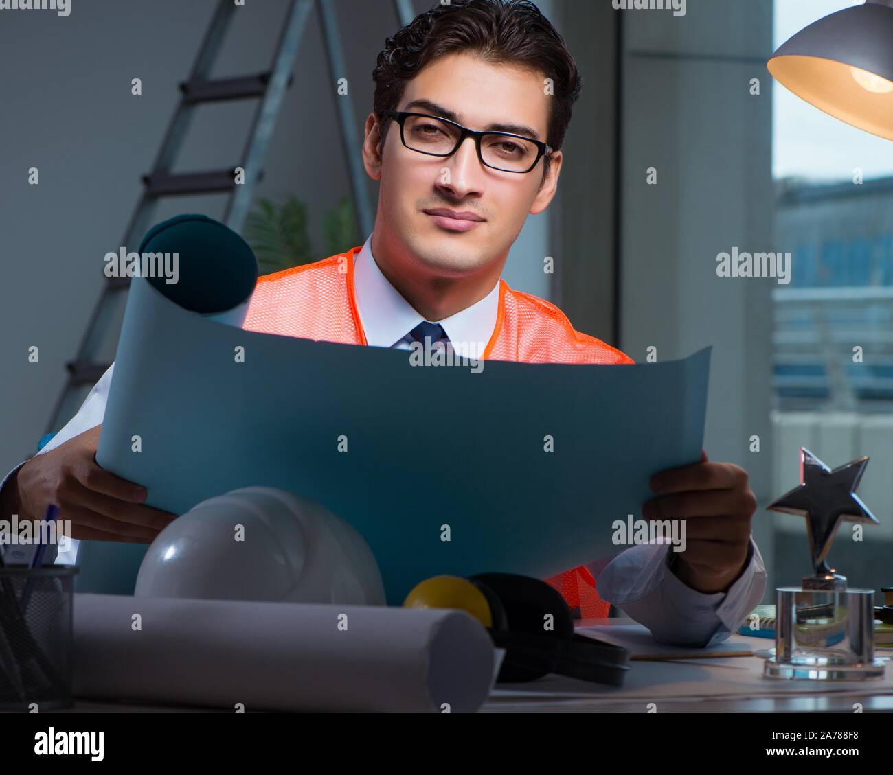 The construction architect working on drawings late at night Stock ...