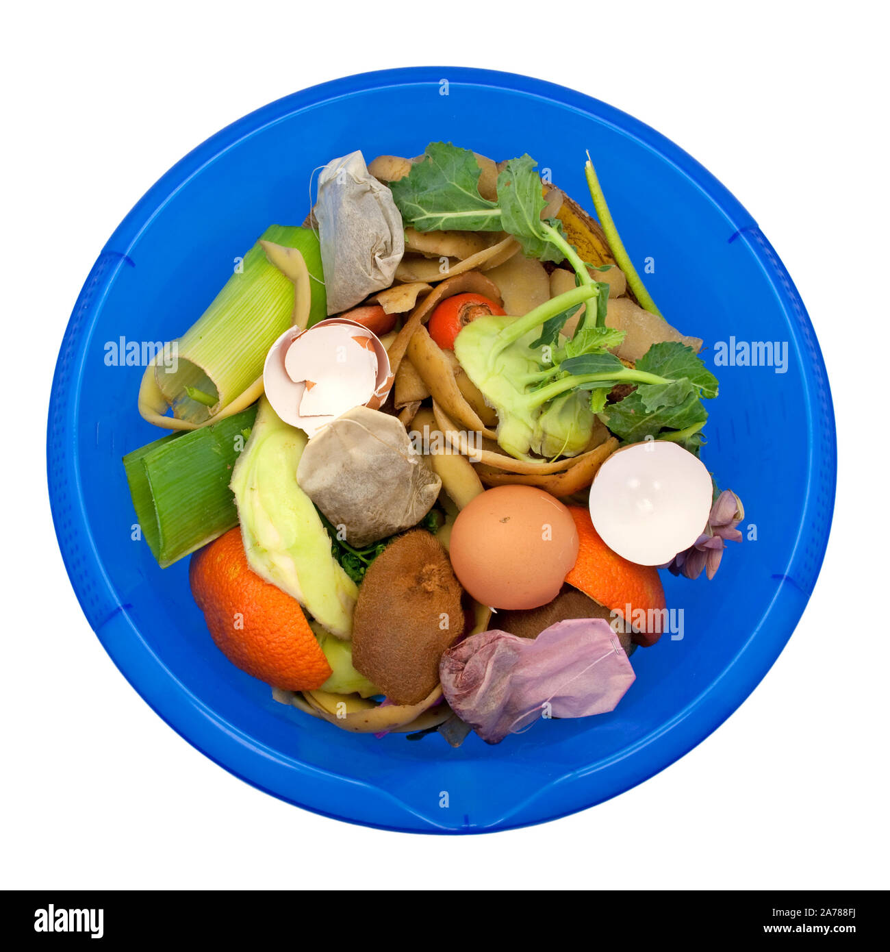 Kitchen waste in a bowl in front of white background Stock Photo - Alamy