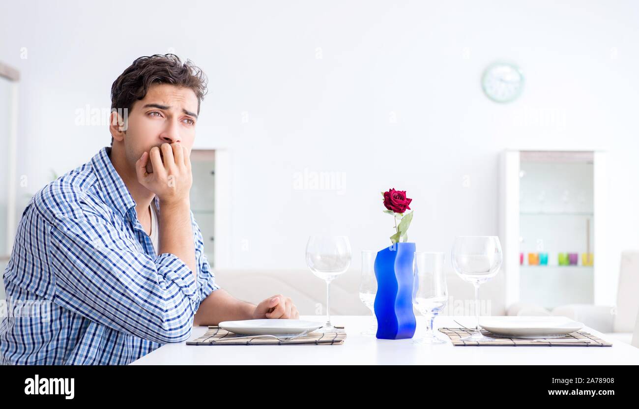 The man alone preparing for romantic date with his sweetheart Stock ...
