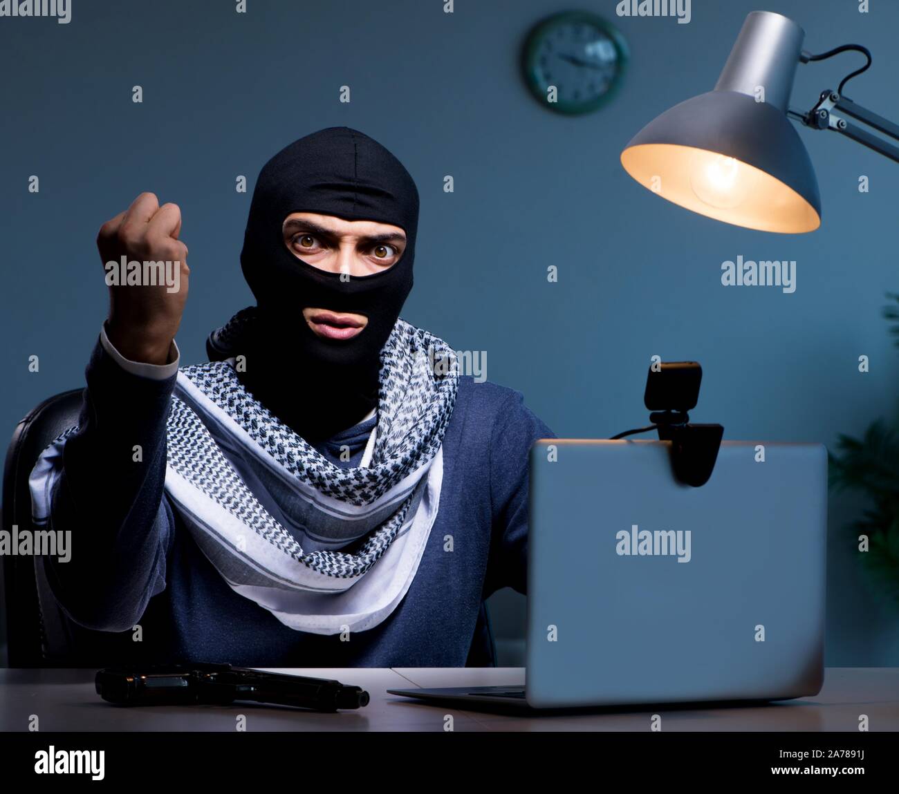 The hacker wearing balaclava mask hacking computer Stock Photo - Alamy