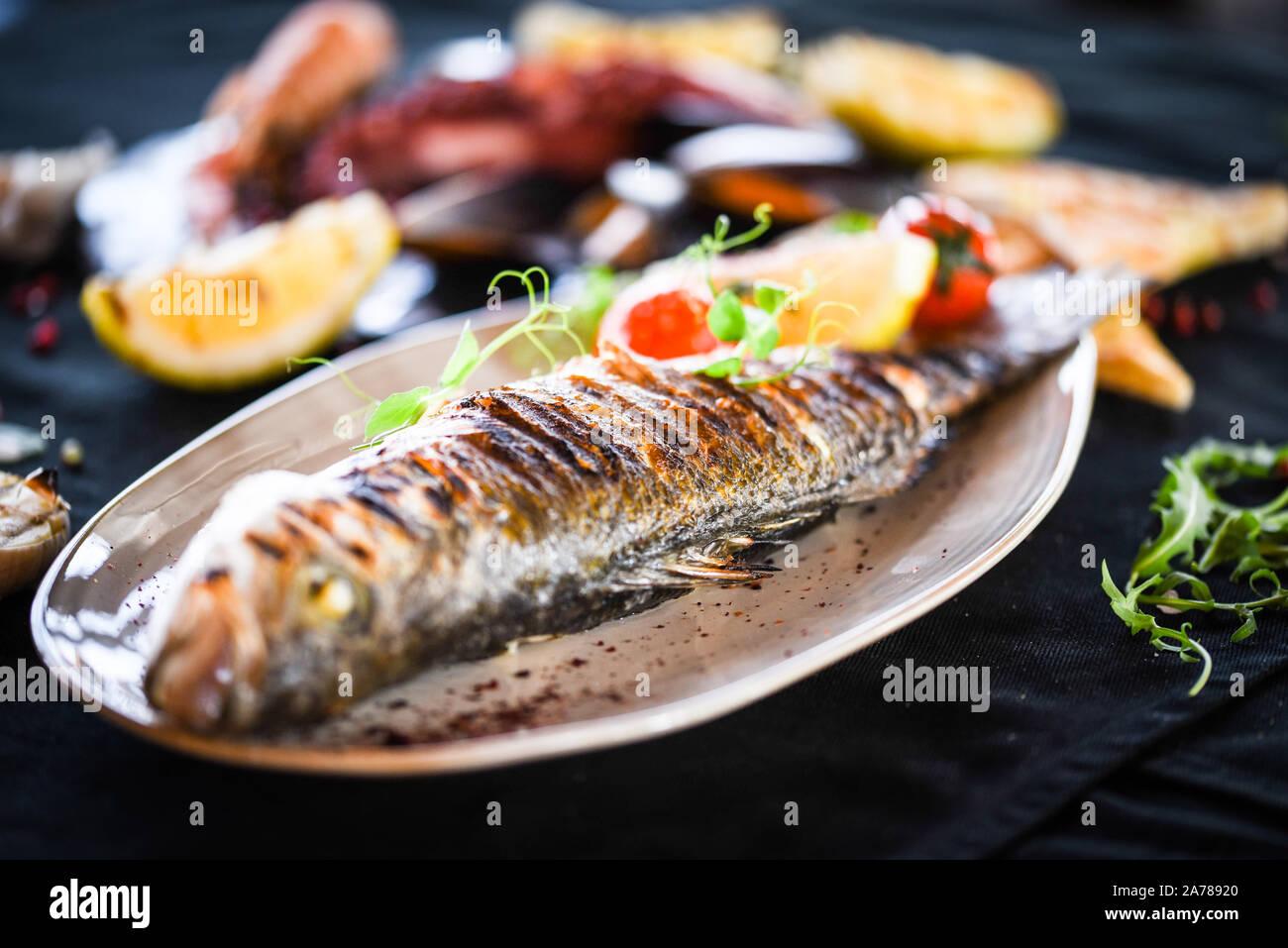 delicious grilled fish with lemon, salt & pepper Stock Photo - Alamy