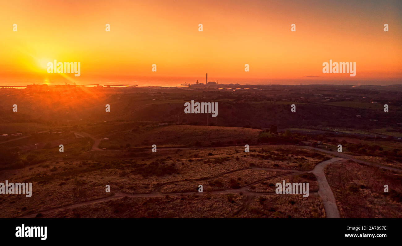 Sunset in its golden hour on the Lazio hills, sun rays over the sea ...