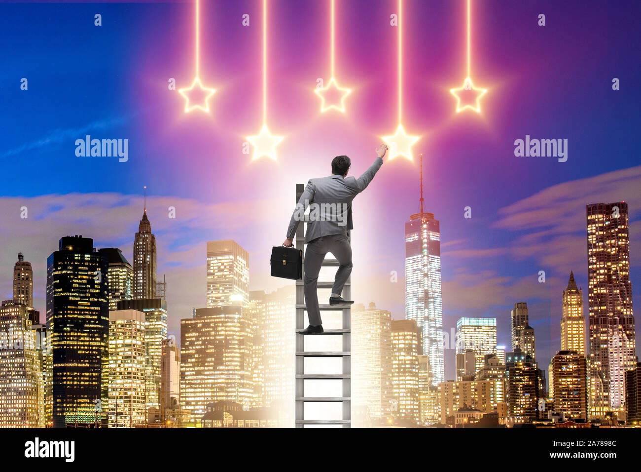 The businessman reaching out for stars Stock Photo - Alamy