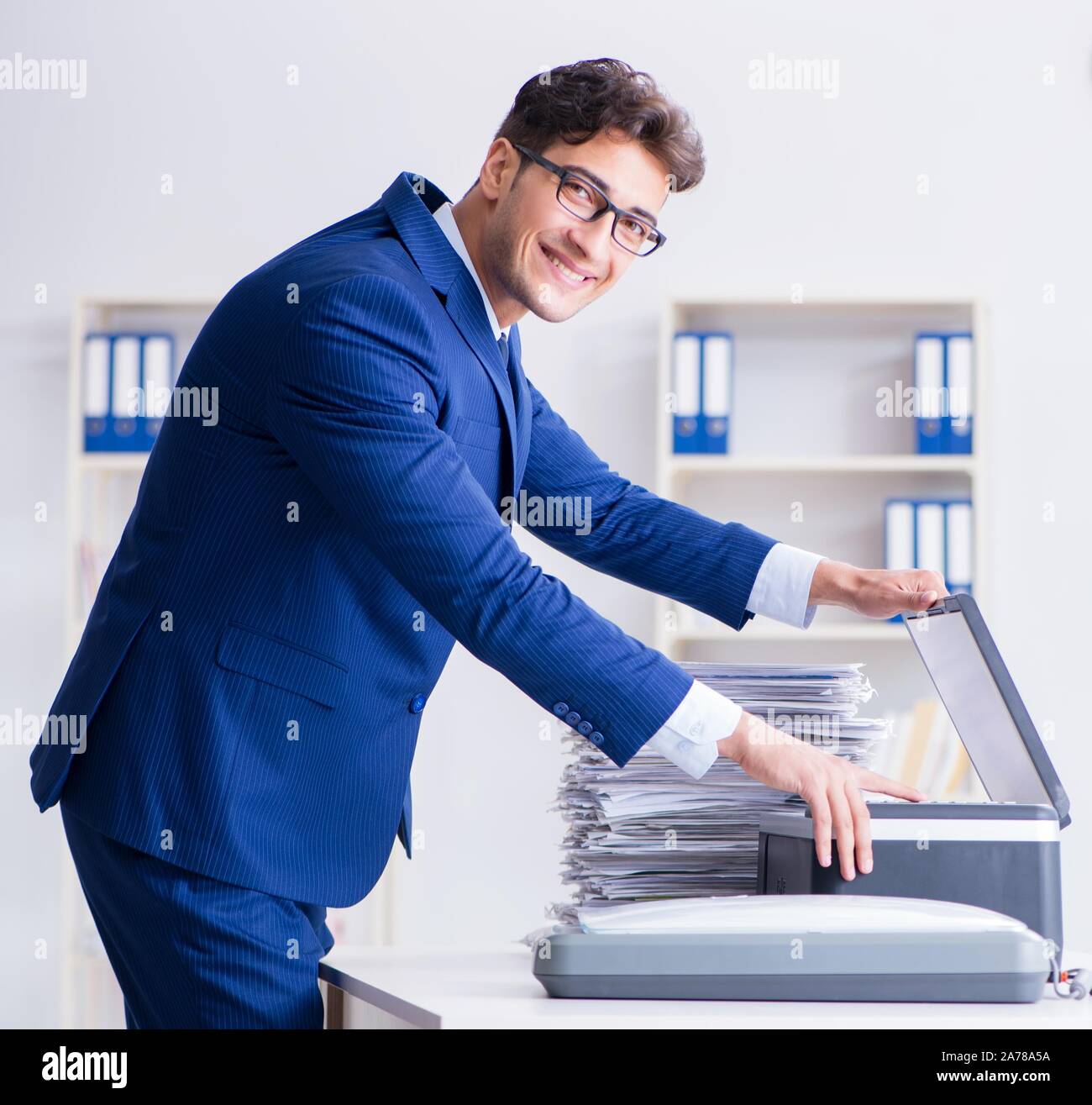 The businessman making copies in copying machine Stock Photo - Alamy