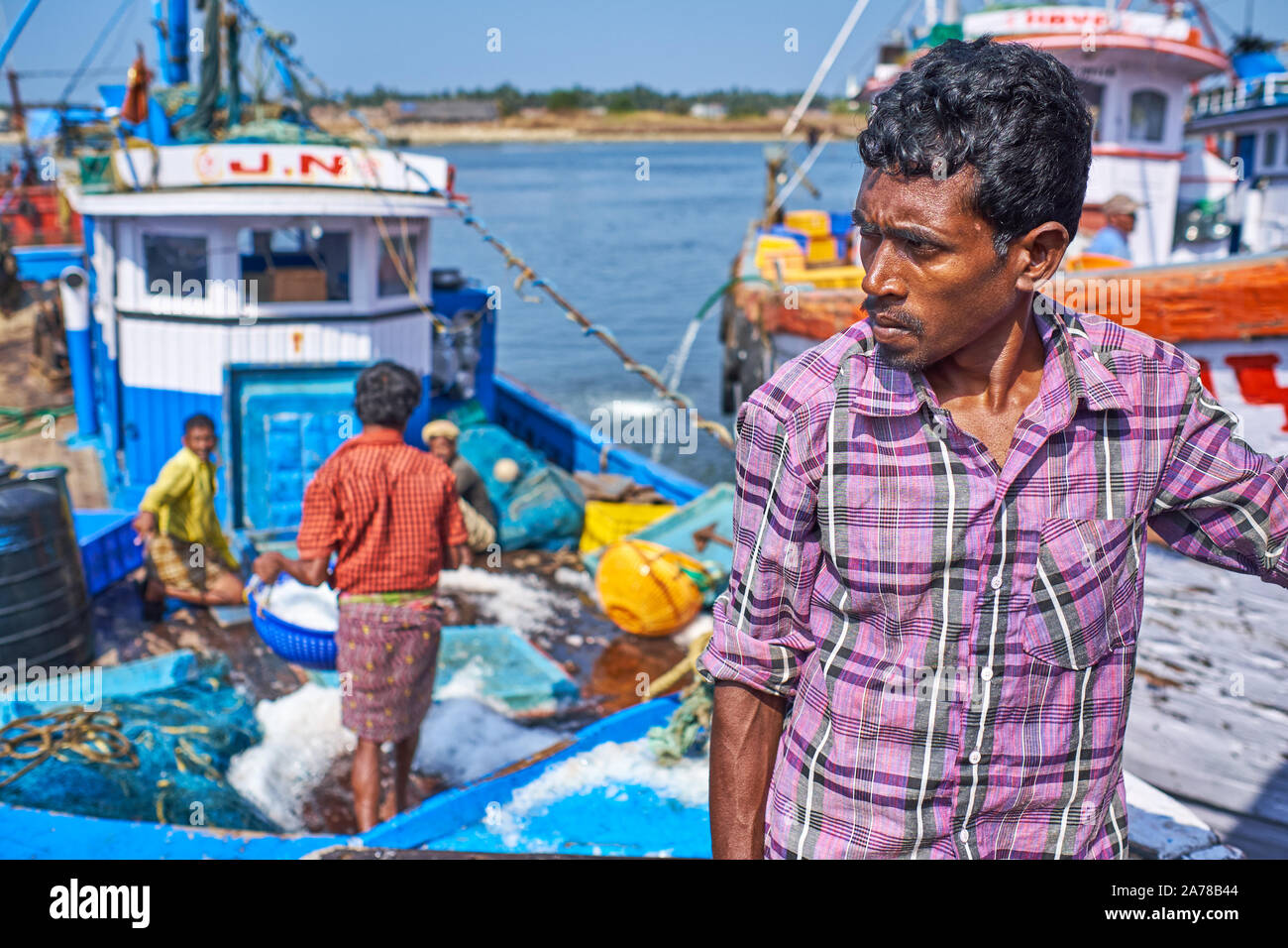 Small, colorful fishing boats in the the Old Port in Mangalore ...