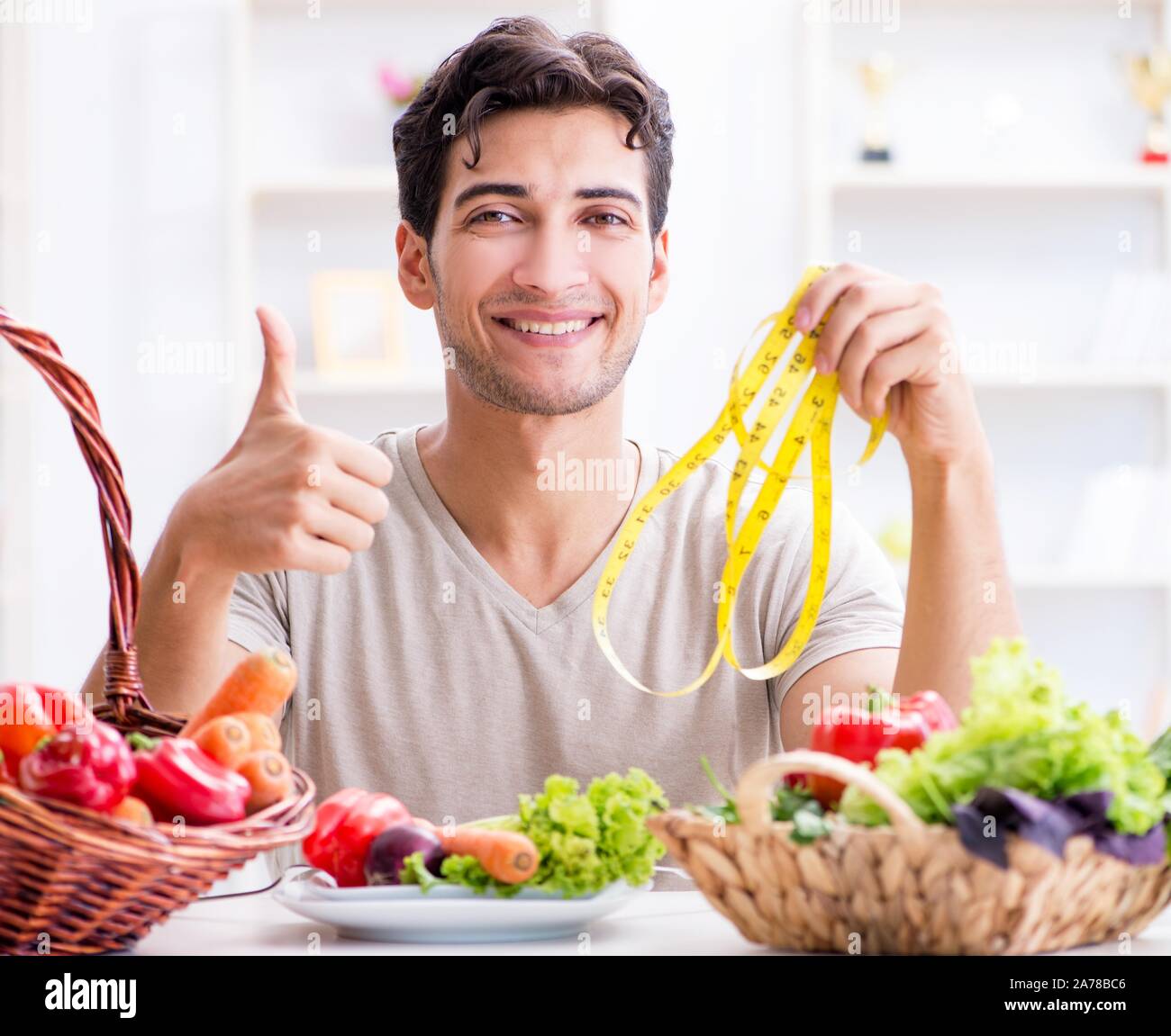 The young man in healthy eating and dieting concept Stock Photo - Alamy