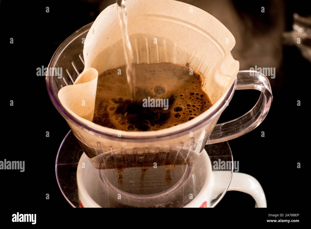 coffee being brewed, filtered on paper filter coffee being brewed ...