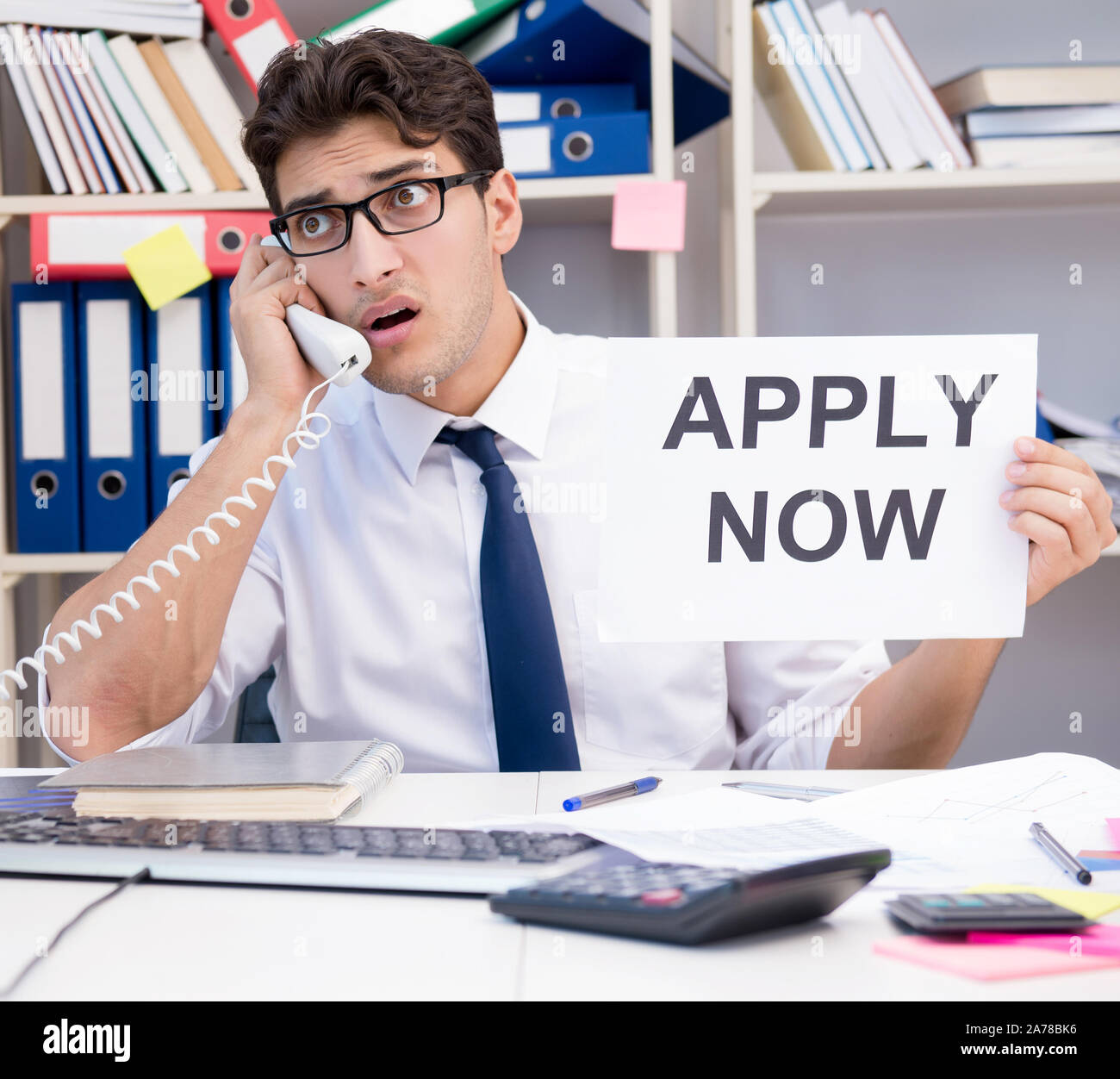 Businessman hiring new employees to cope with increased workload Stock ...