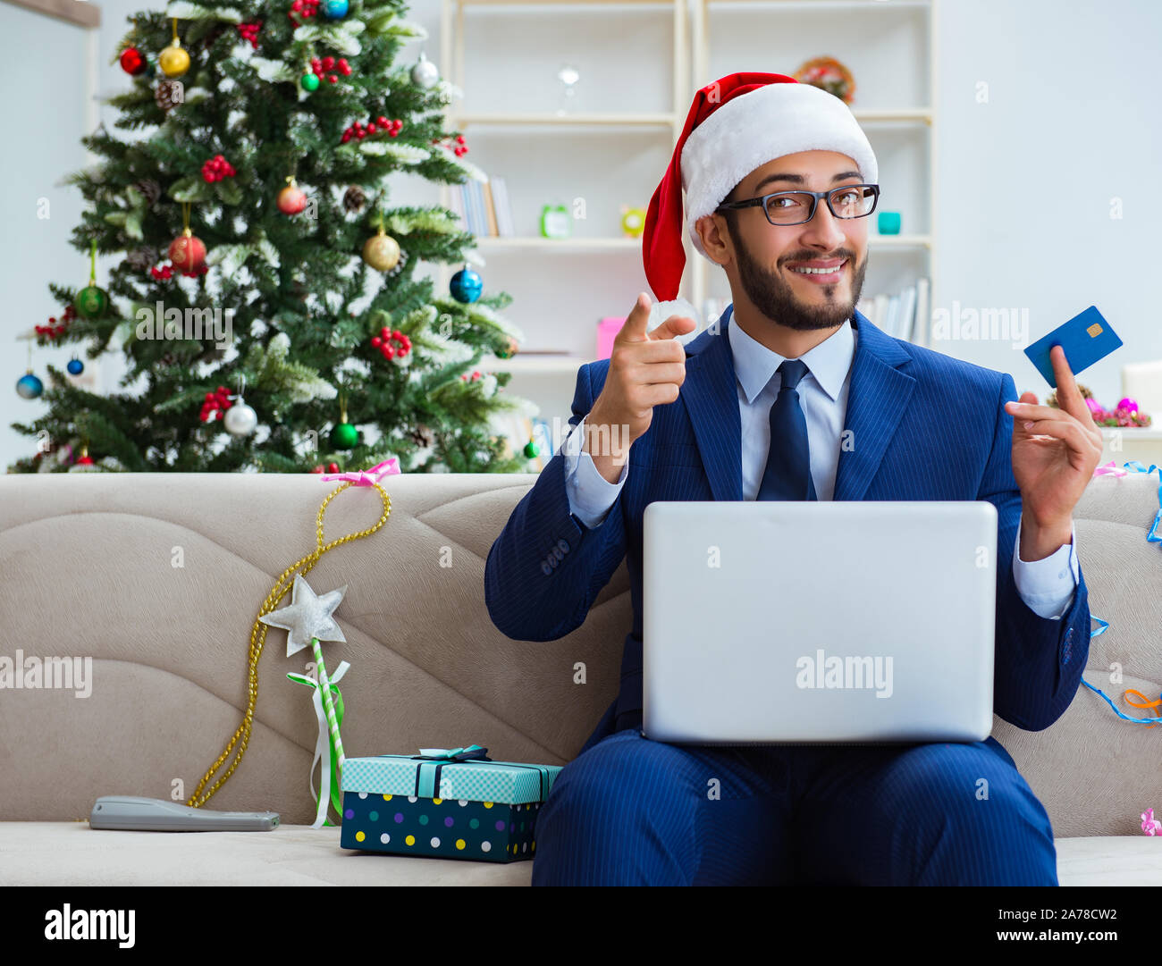 The businessman working at home during christmas Stock Photo - Alamy
