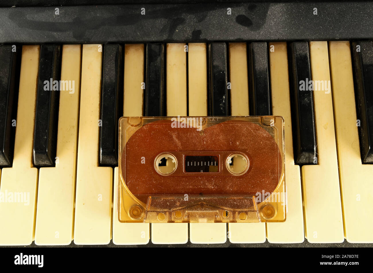 Photo picture close-up of piano keys keyboard and musicassette tape ...
