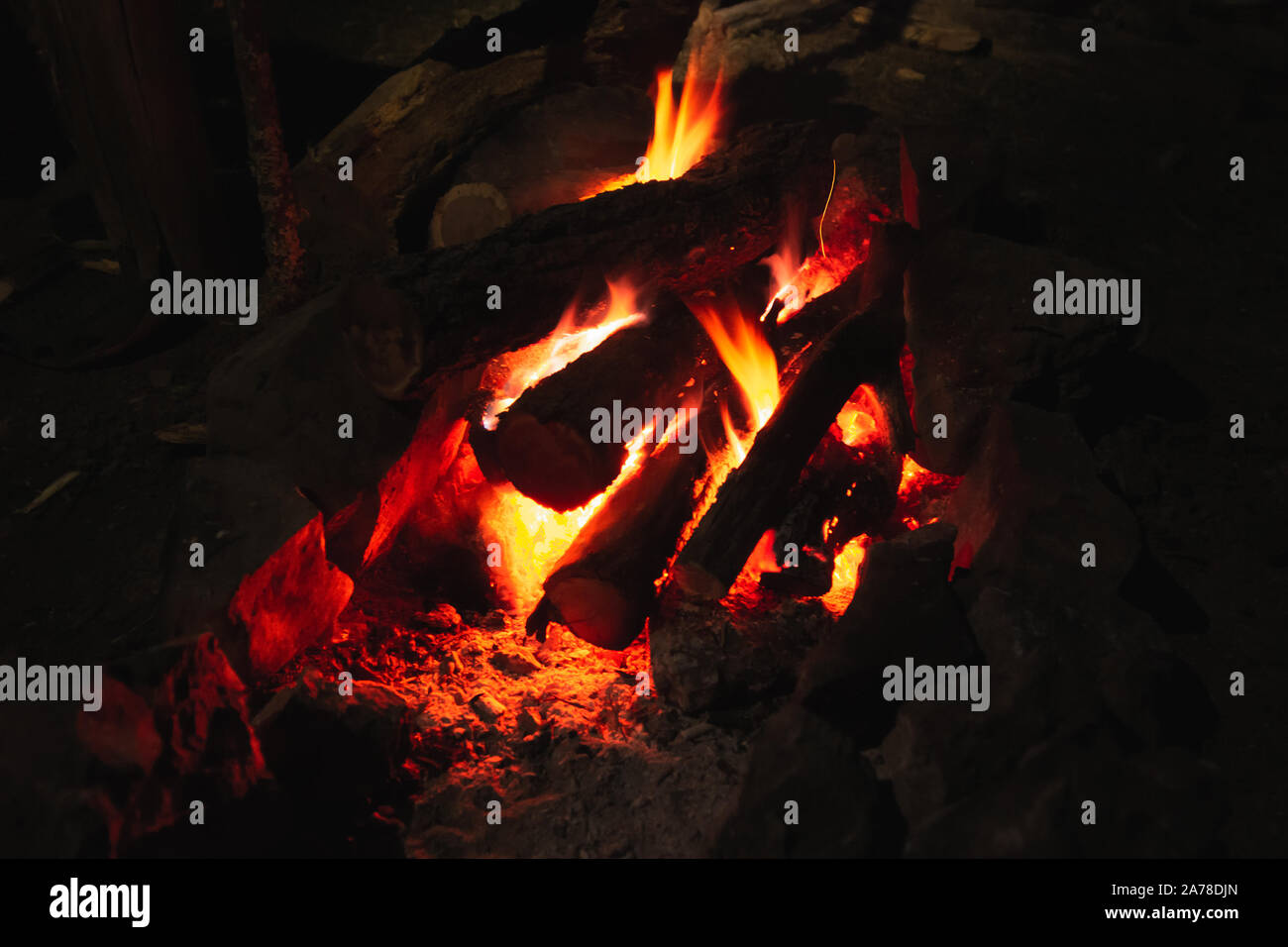Burning fire in a fireplace at night, natural photo background Stock ...
