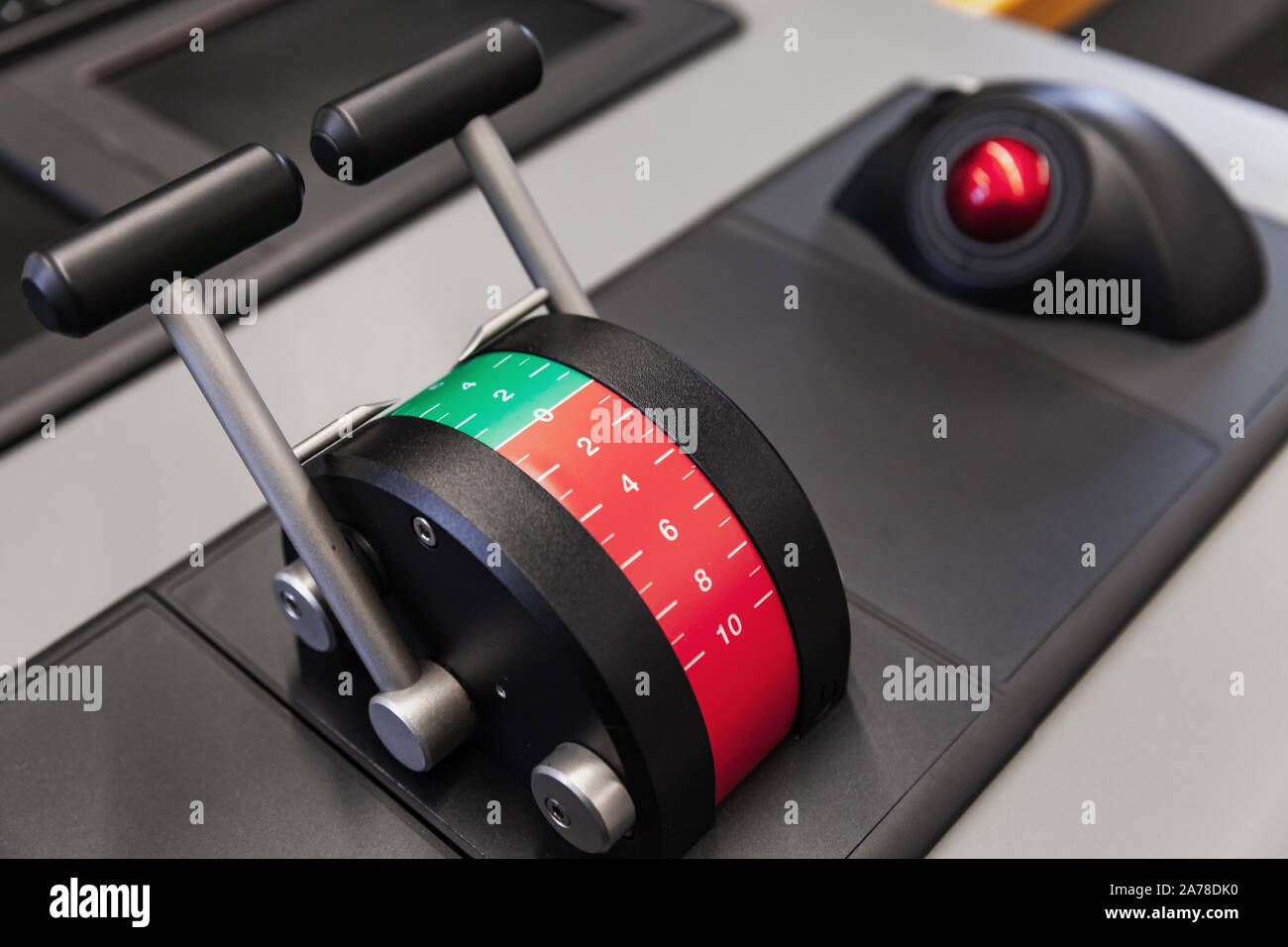 Modern ship control panel with engine accelerator and red trackball ...