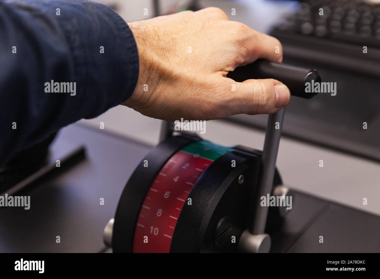 Captains hand moves an engine accelerator on modern ship control panel ...
