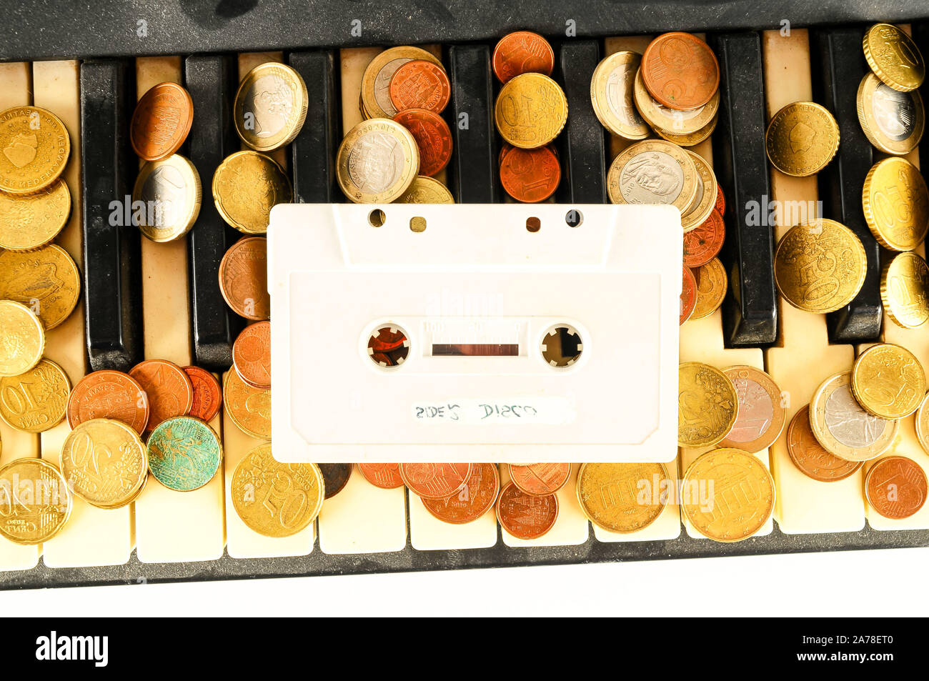 Photo picture close-up of piano keys keyboard and musicassette tape ...