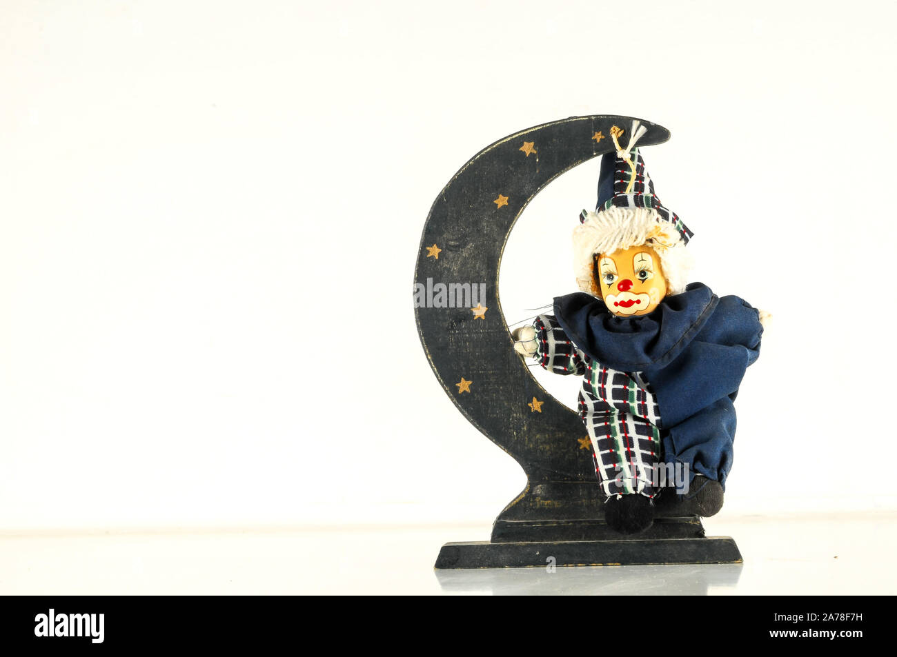 Photo of Pierrot toy doll on white background Stock Photo - Alamy