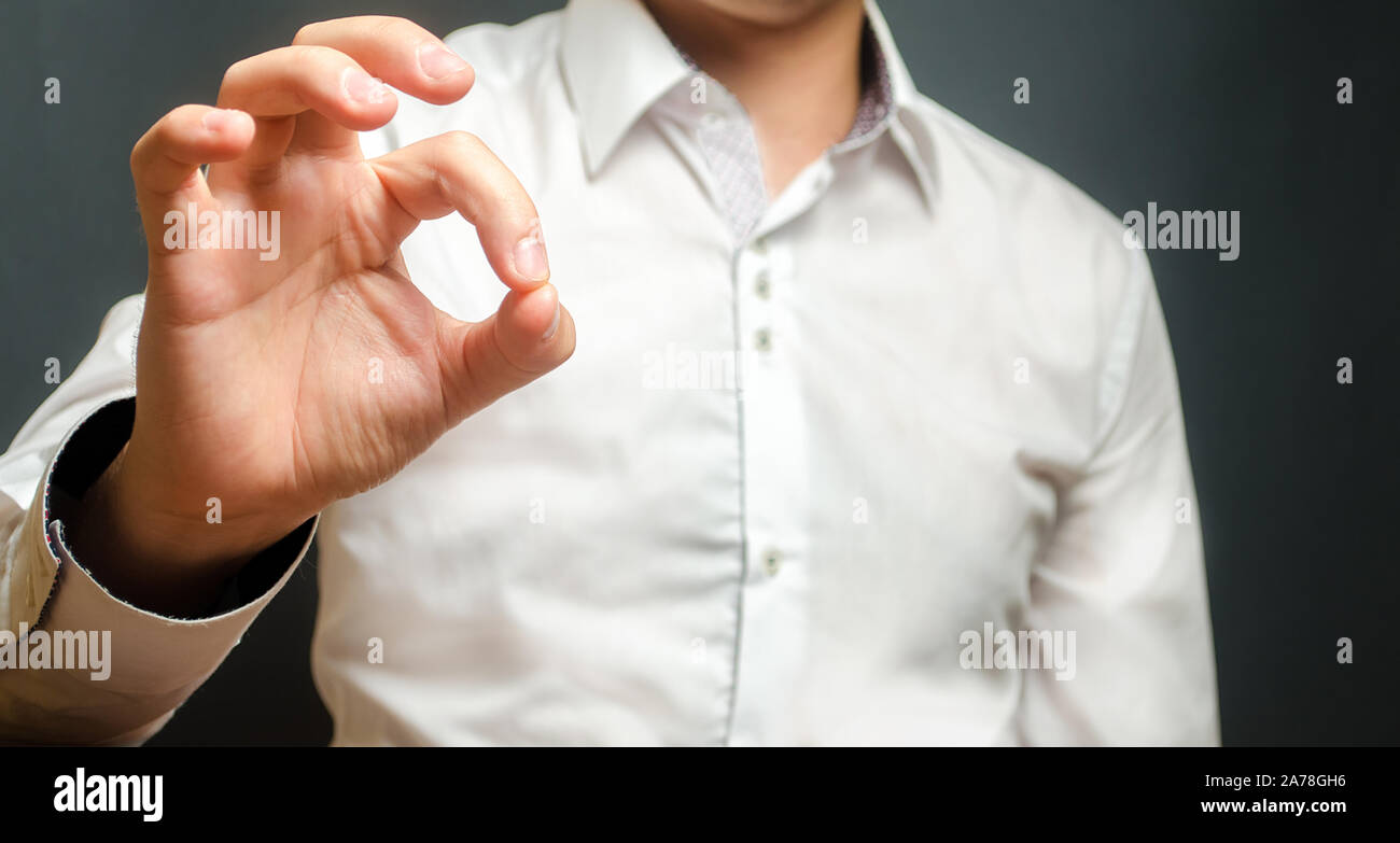 Man shows okay sign with his hand. Approval and consent, acceptance of ...