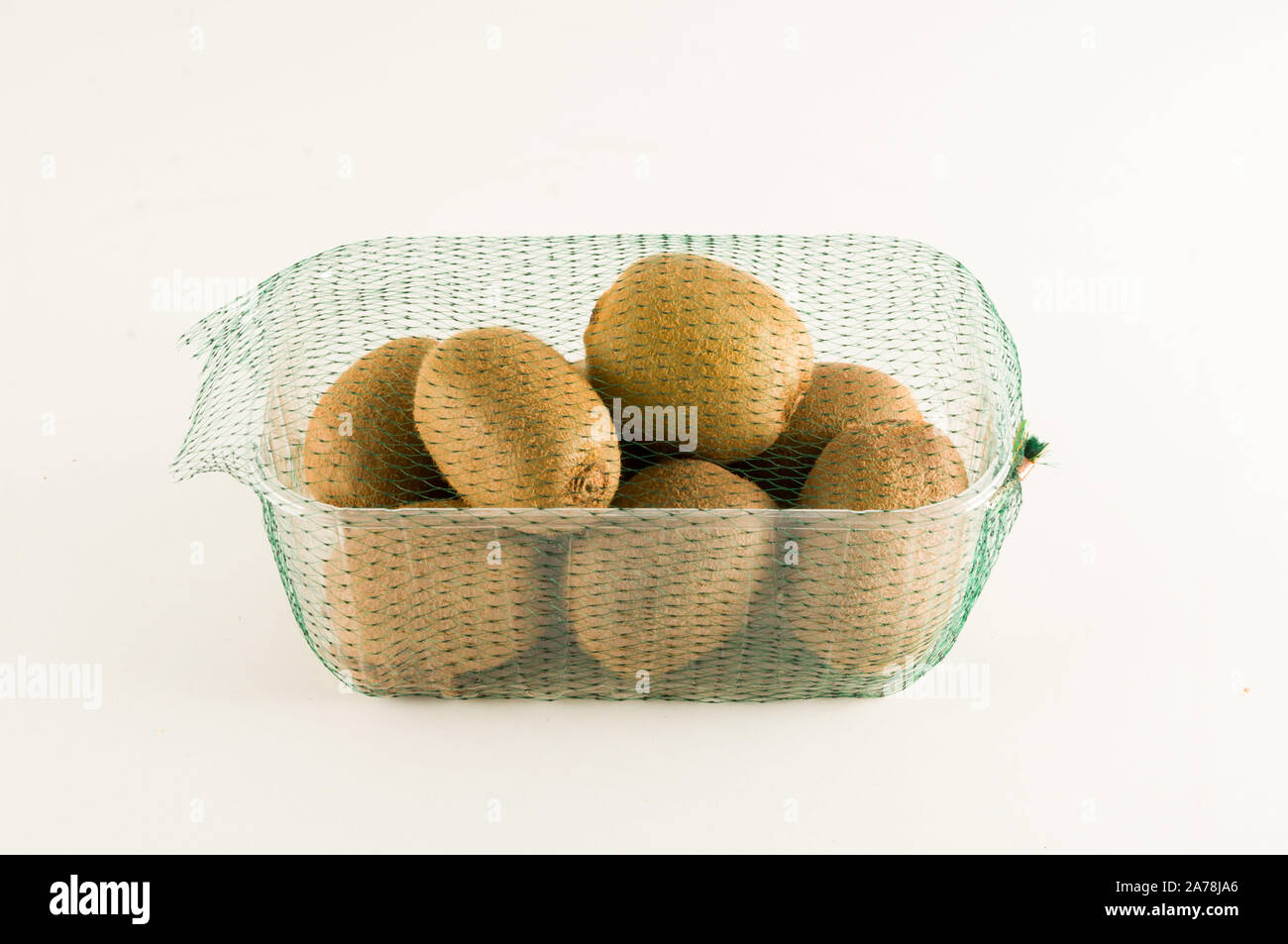 Kiwi in a box isolated on white background Stock Photo - Alamy