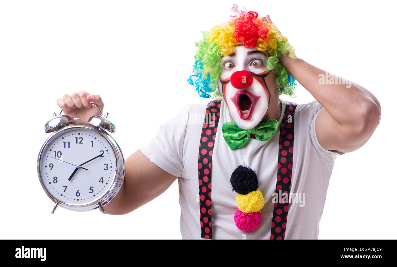 The funny clown with an alarm clock isolated on white background Stock ...