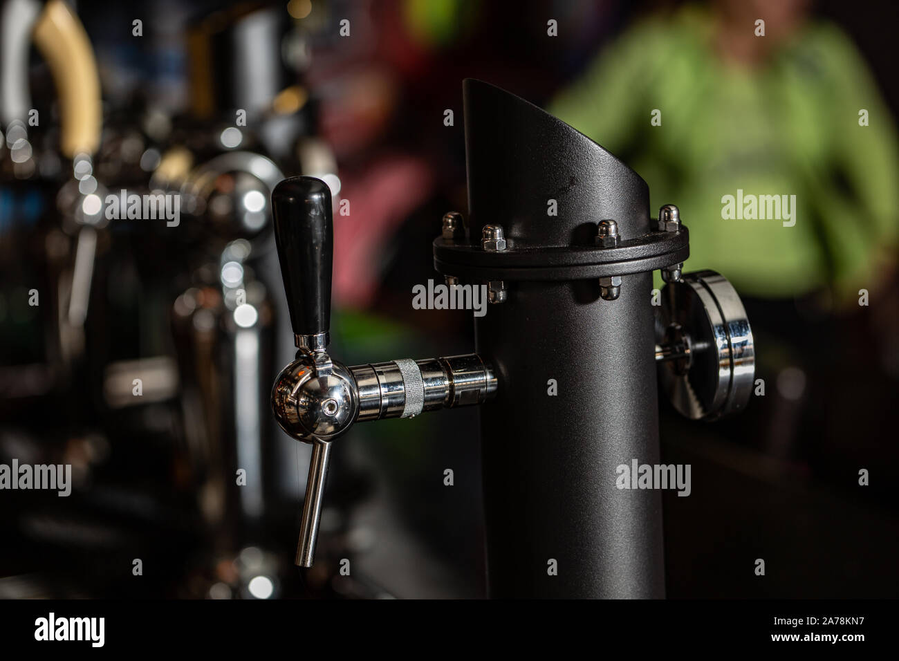 Black beer tap in the bar Stock Photo - Alamy