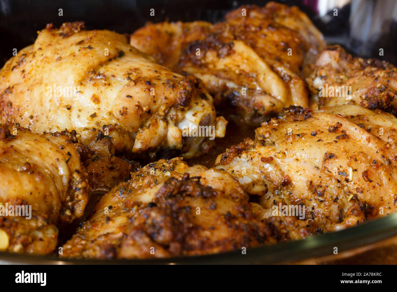 portions of chicken, baked in the oven Stock Photo - Alamy